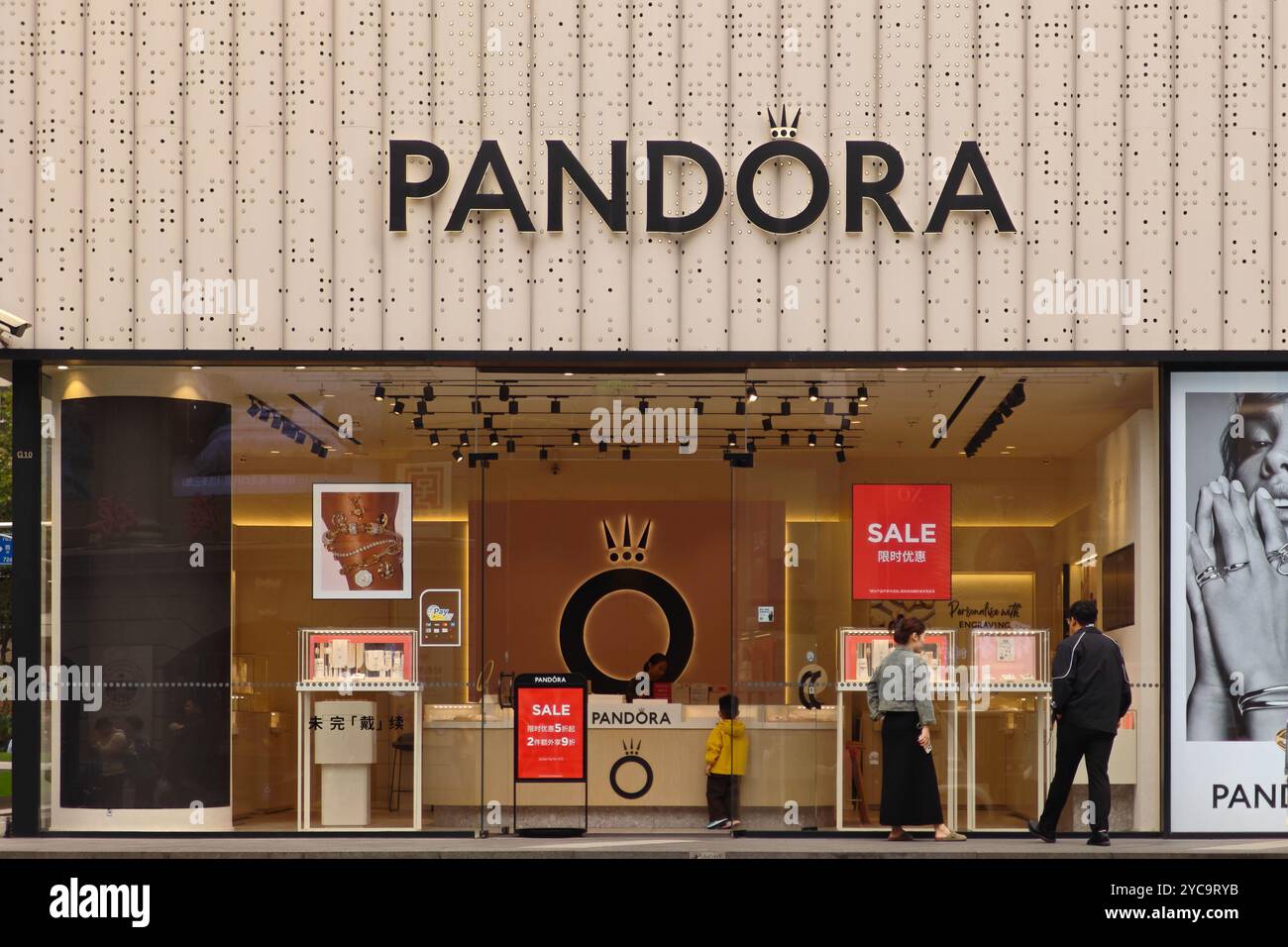 SHANGHAI, CHINA - OCTOBER 22, 2024 - Pedestrians pass the Pandora ...