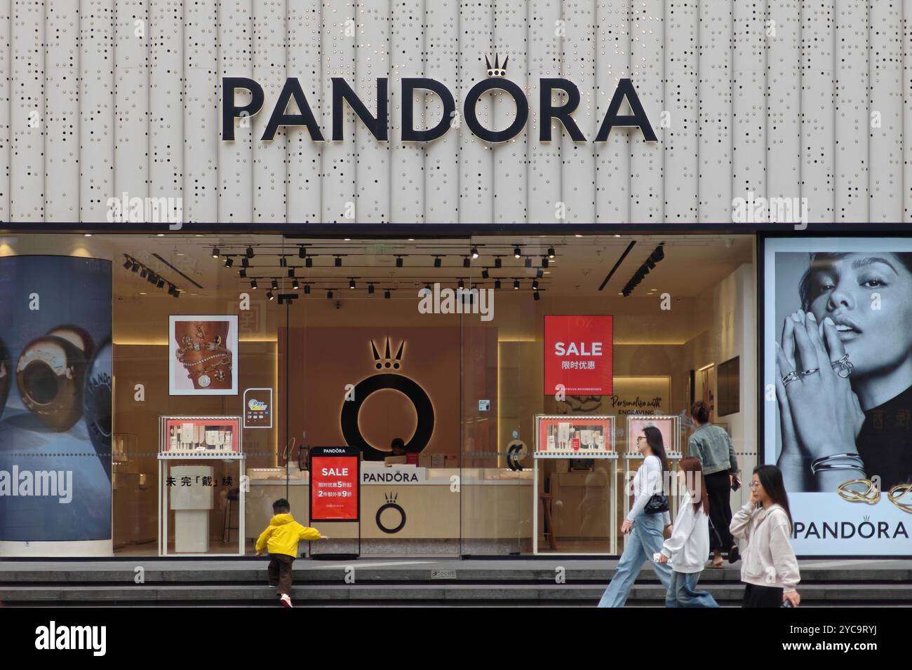 SHANGHAI, CHINA - OCTOBER 22, 2024 - Pedestrians pass the Pandora ...