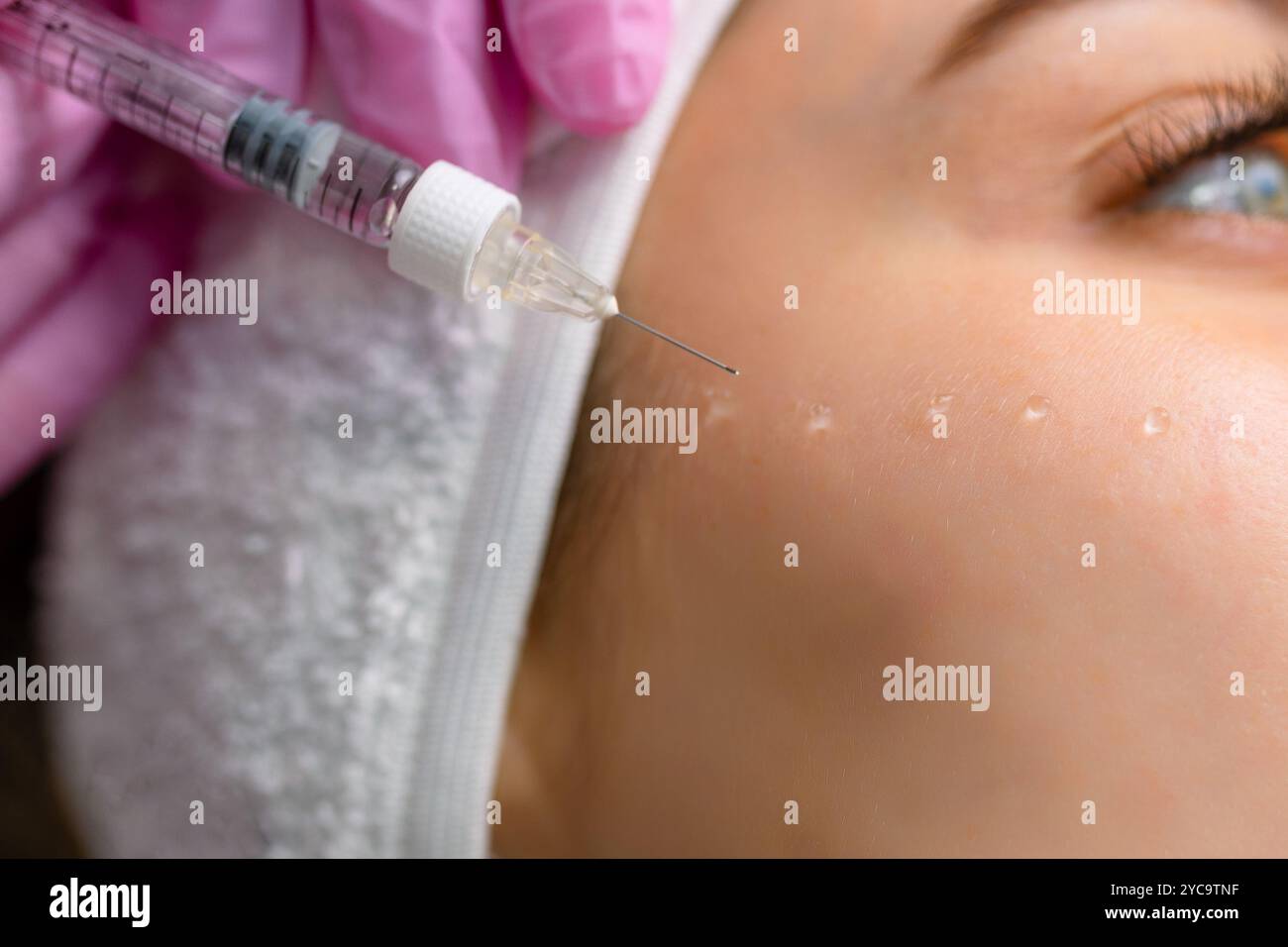 Beautiful relaxed woman at beautician cabinet receiving anti wrinkle ...