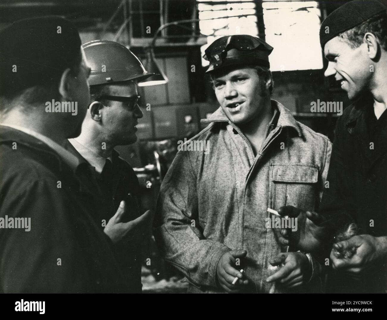 Soviet professional weightlifter Vasily Kolotov working as mechanic ...