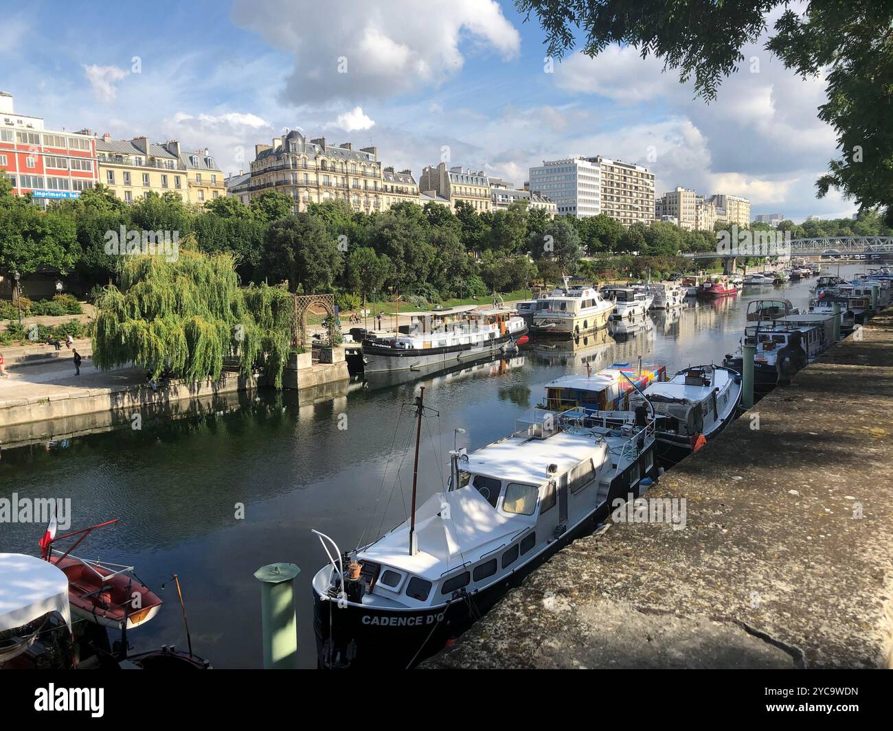 View of the Seine river, boats and Haussmann buildings in the 12th arrondissement of Paris ...