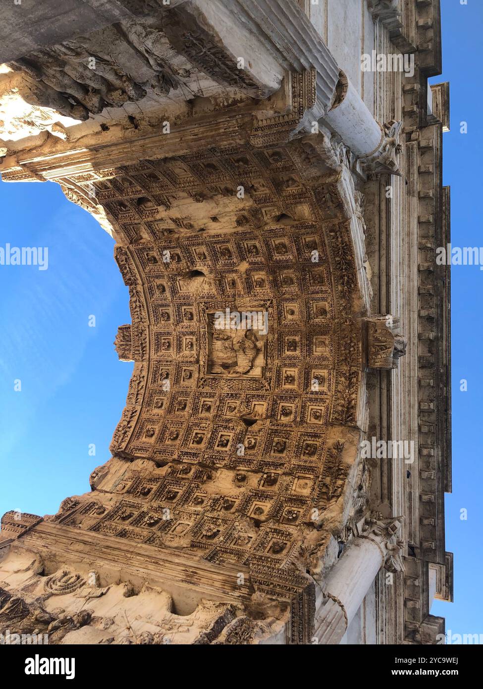 View of the famous Arch of Titus from its bottom in the Roman Forum in ...