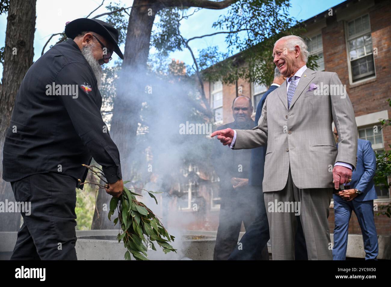 King Charles III participates in a smoking ceremony during a visit to ...