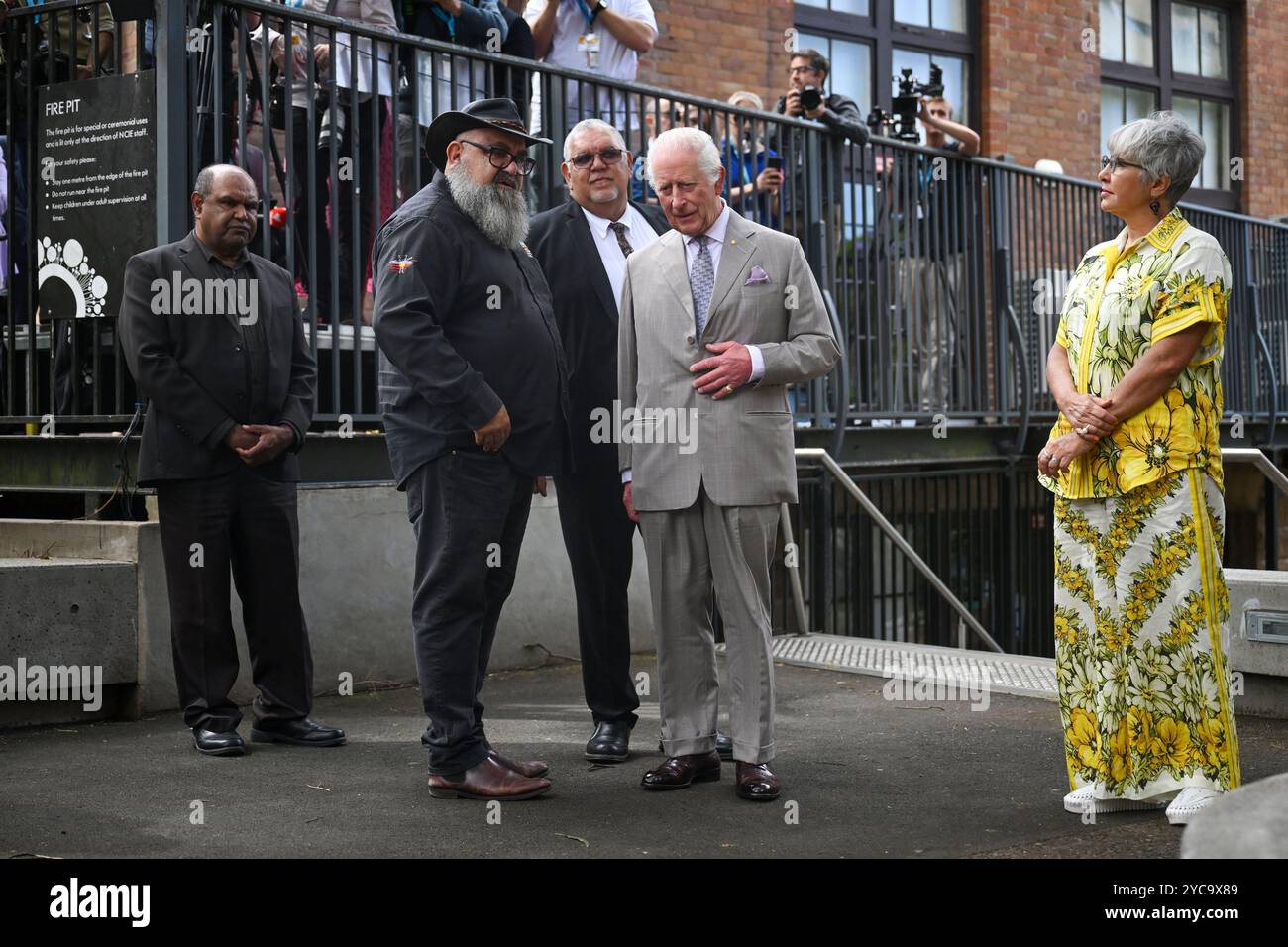 King Charles III participates in a smoking ceremony during a visit to ...