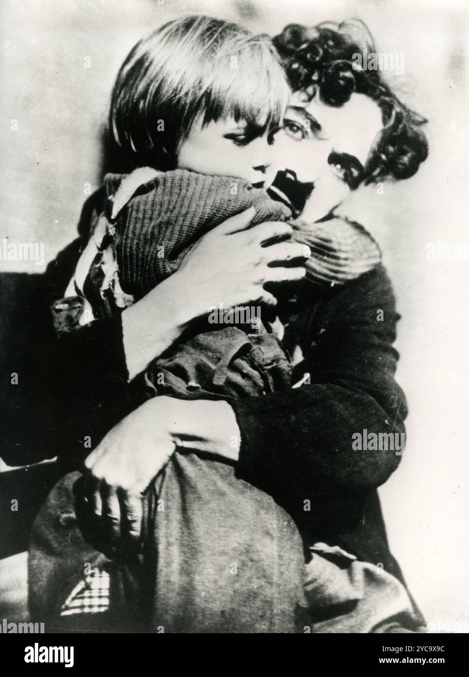 British actor Charlie Chaplin in the movie The Kid, 1921 Stock Photo ...