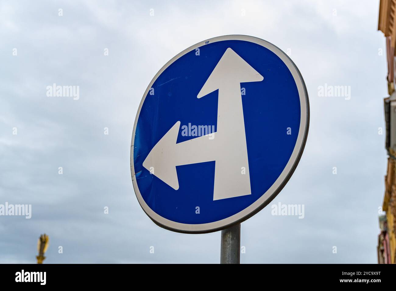 Directional road sign indicating multiple routes for vehicles at an ...