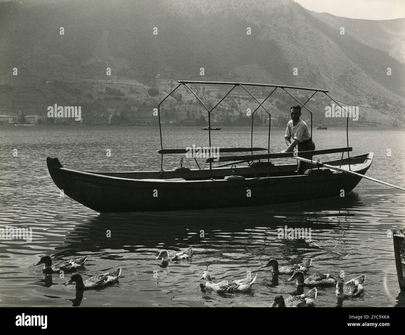 Sailor with a rowing boat at Lago d´Iseo, Italy 1940s Stock Photo - Alamy