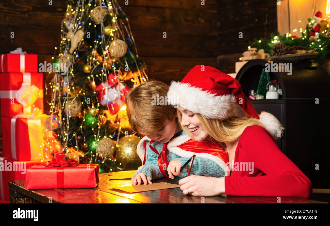 Christmas Child son and mother Write Letter to Santa Claus. Lovely ...