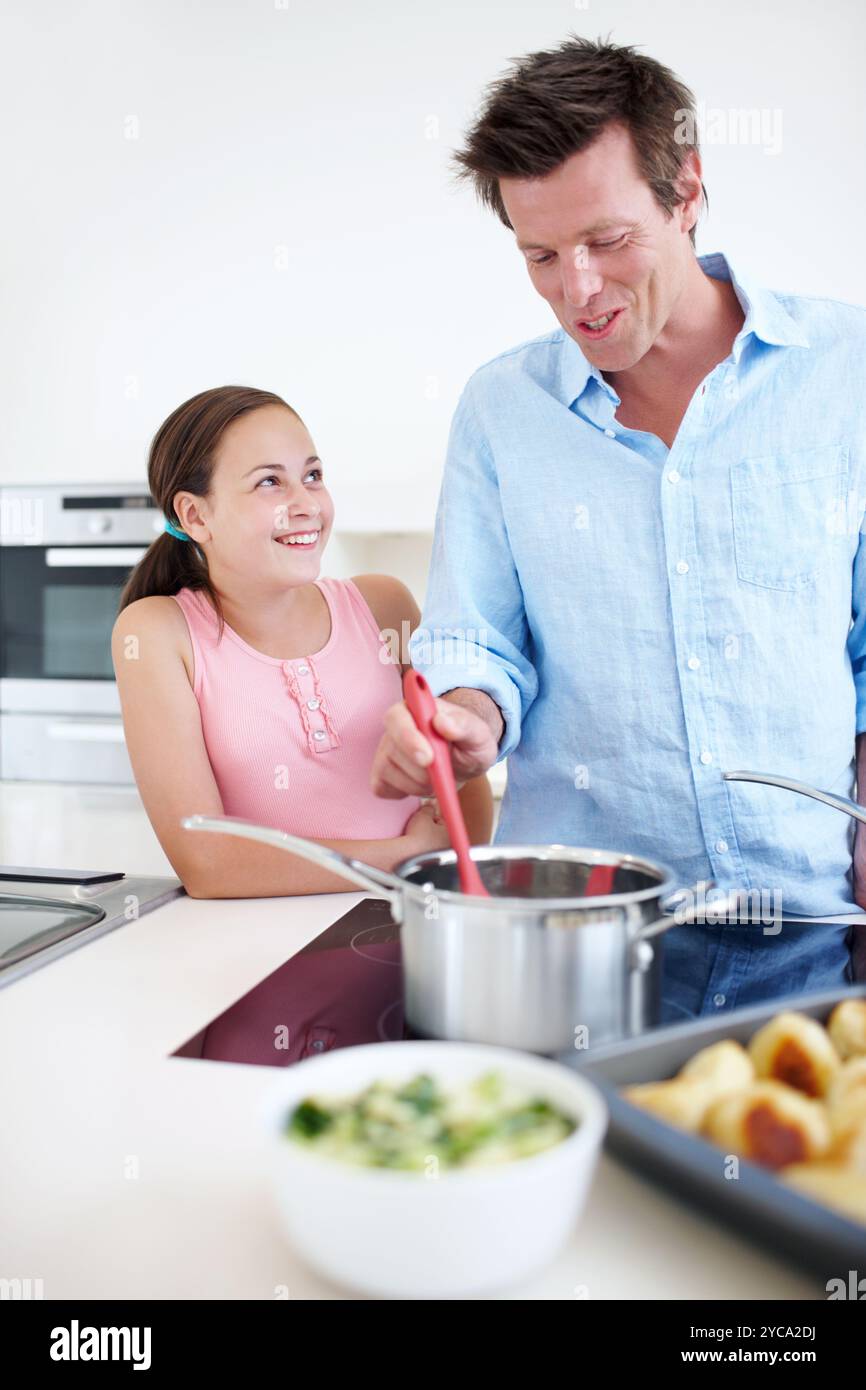 Home, kid and father with pot for cooking, ingredients and food ...