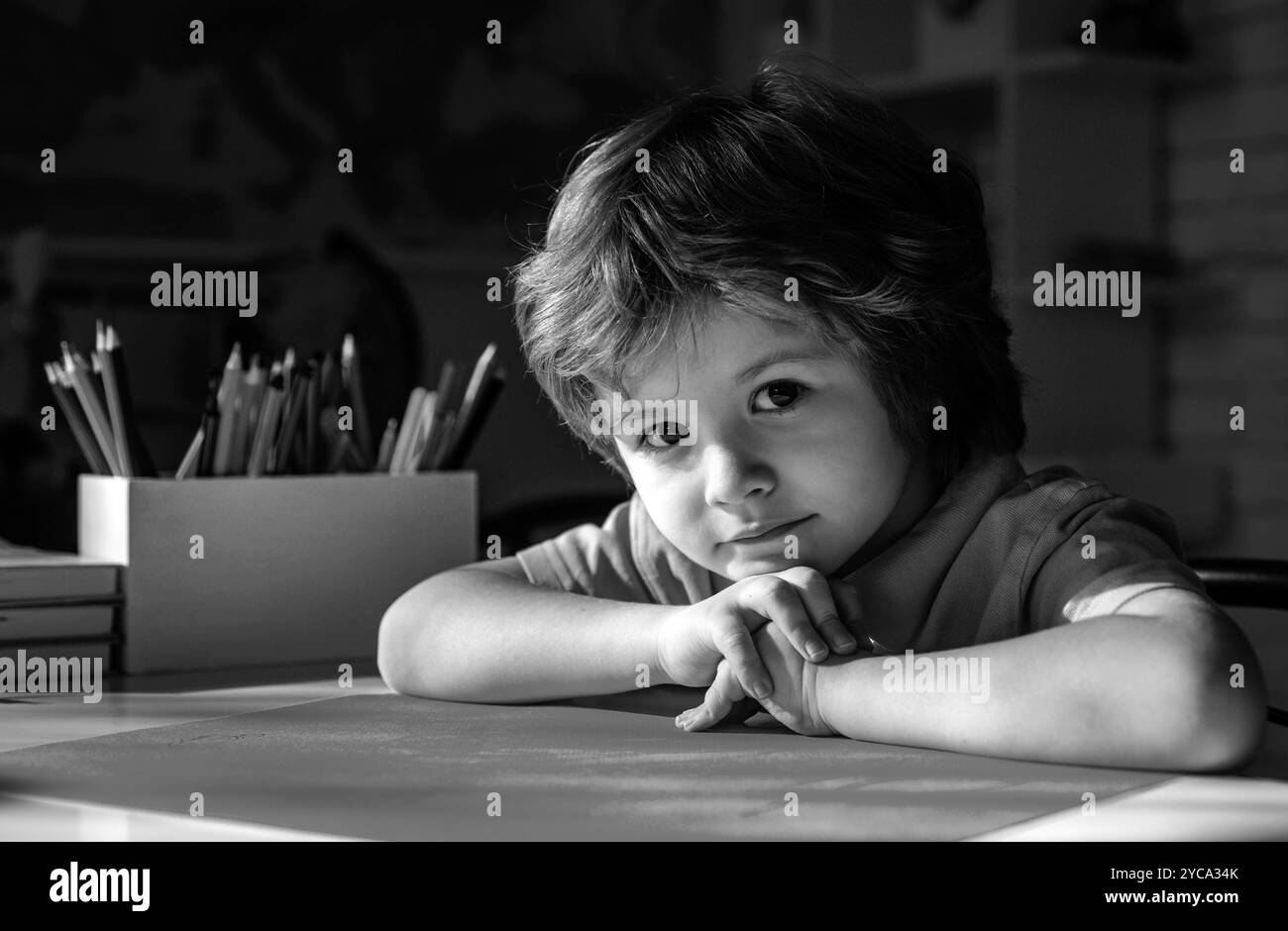 Portrait of elementary pupil looking at camera. Cute child boy in ...