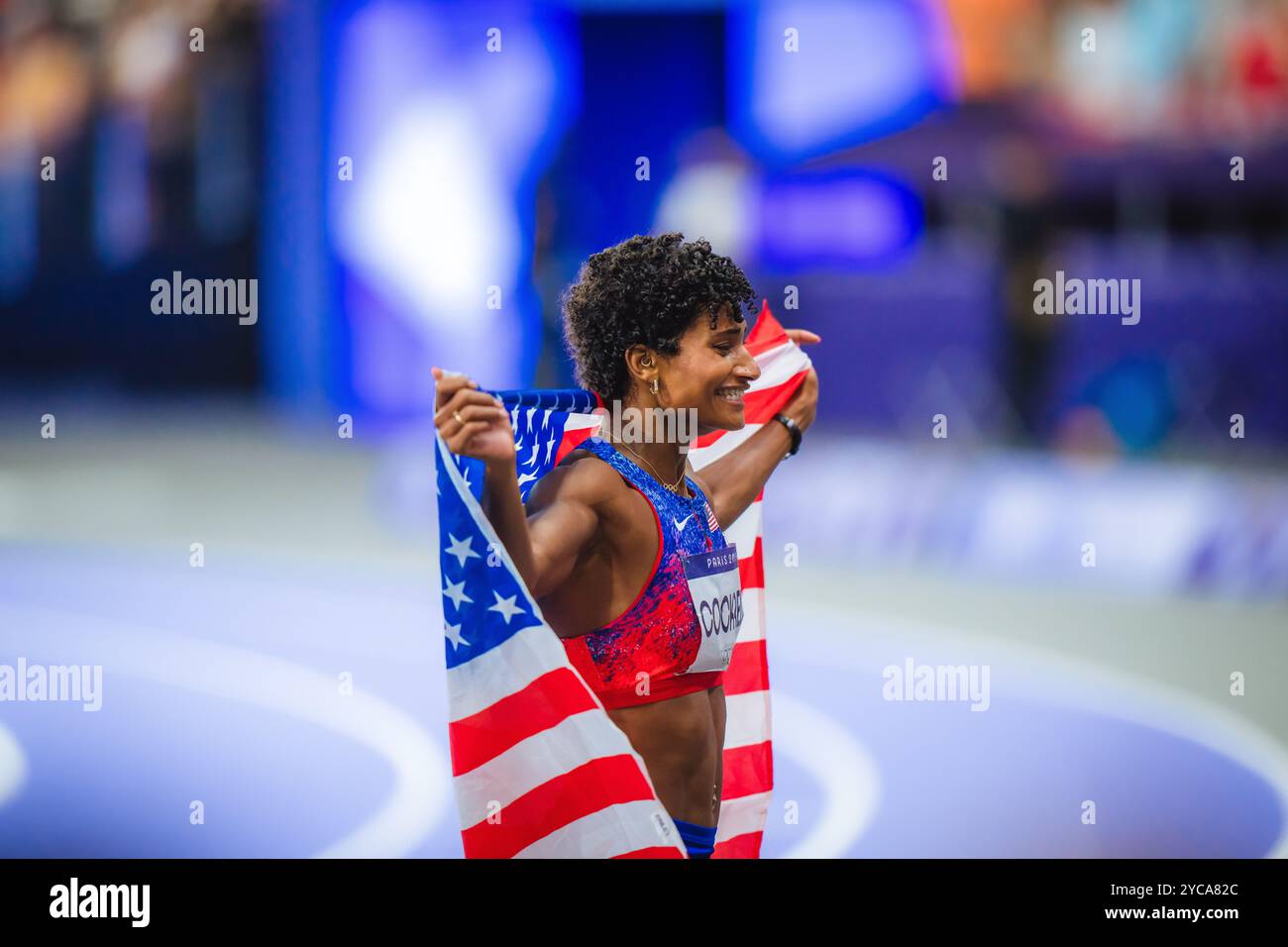 Anna Cockrell celebrating with her country's flag in the 400 meters ...