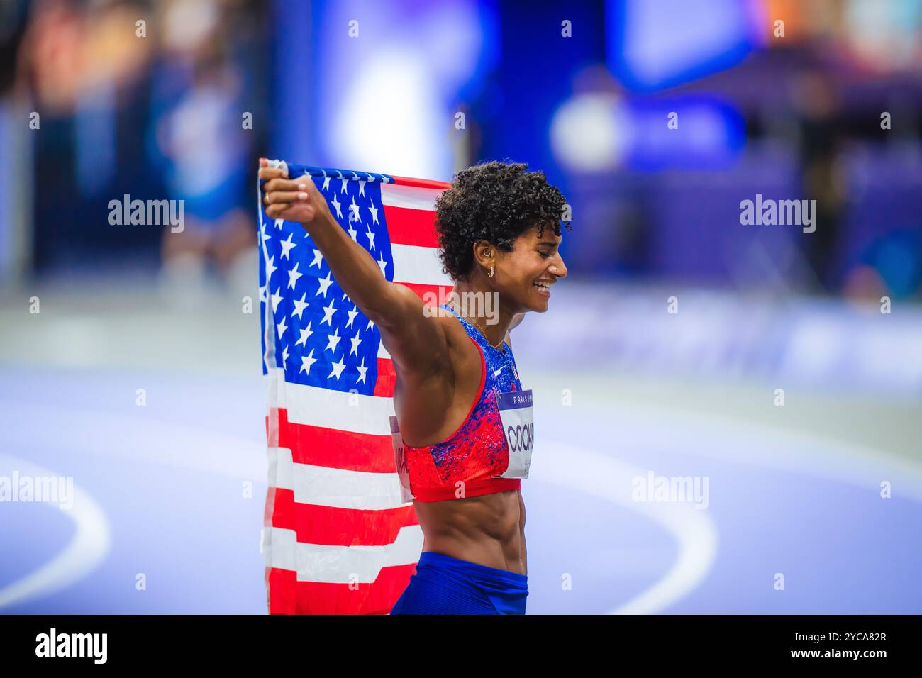 Anna Cockrell celebrating with her country's flag in the 400 meters ...