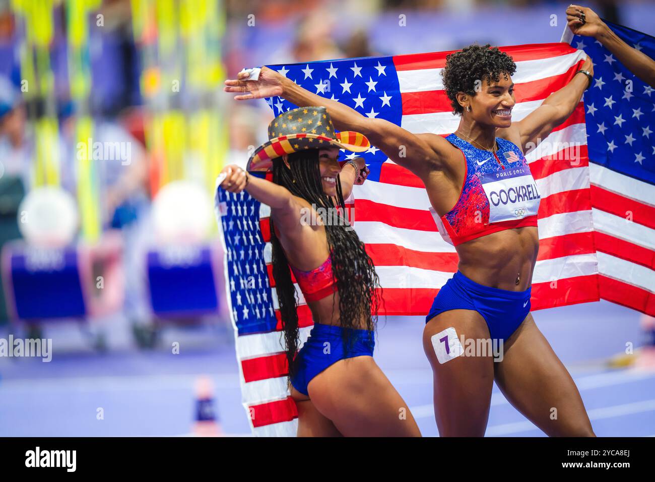 Anna Cockrell celebrating with her country's flag in the 400 meters ...