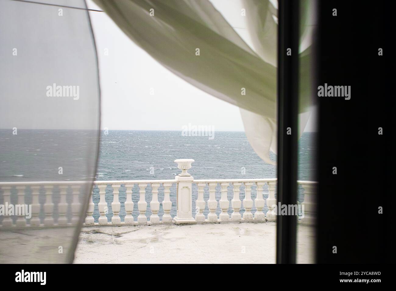 empty promenade while the storm, view from an open window Stock Photo ...