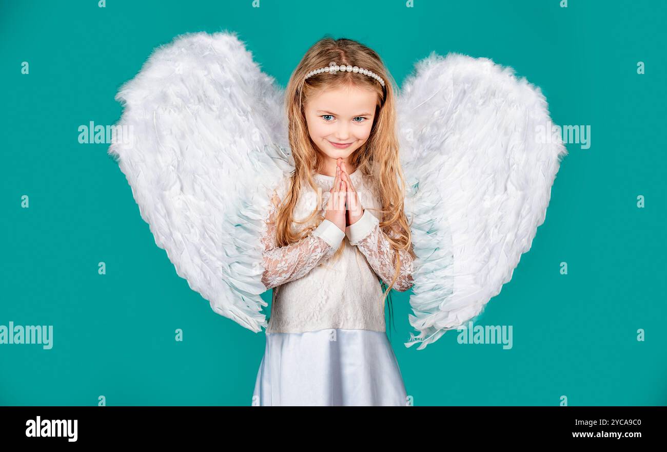 Child with angelic face. Cute child girl posing with angel wings ...