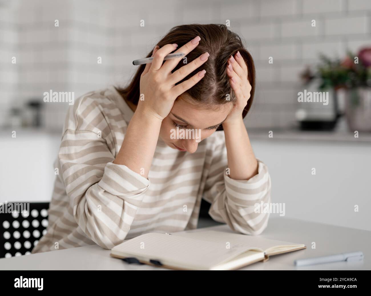 Girl Holds Head, Not Understanding What To Write, Does Homework Stock ...