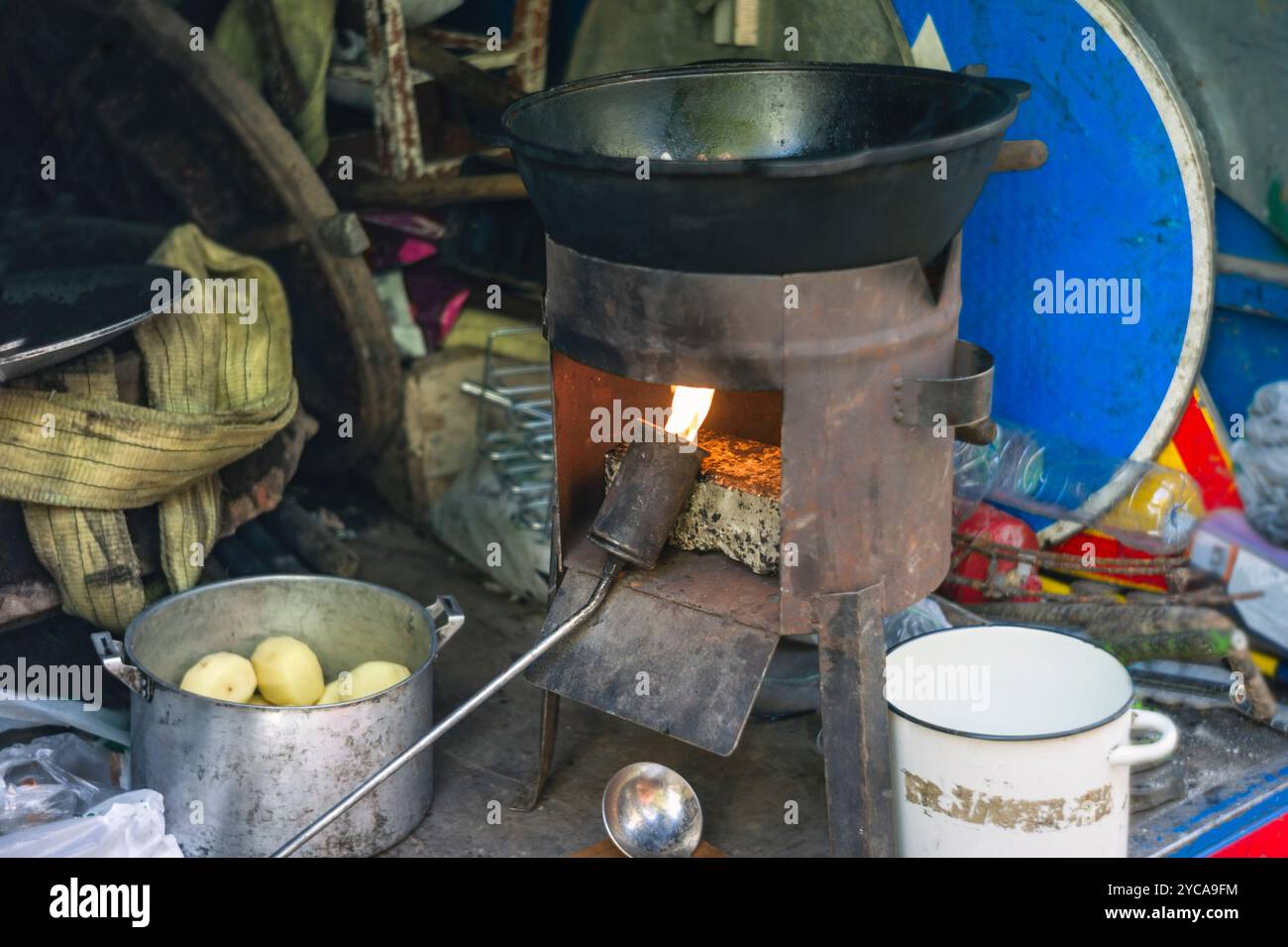 cooking with a gas burner in messy conditions, concept of unhygienic ...