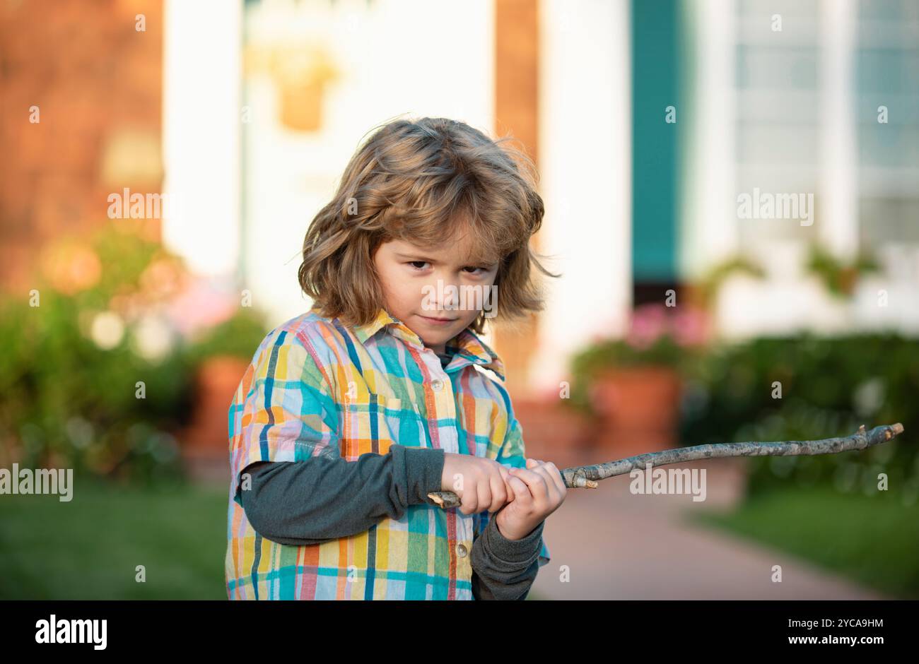 Child aggression. Negative kids emotion. Angry boy with stick. Kid ...