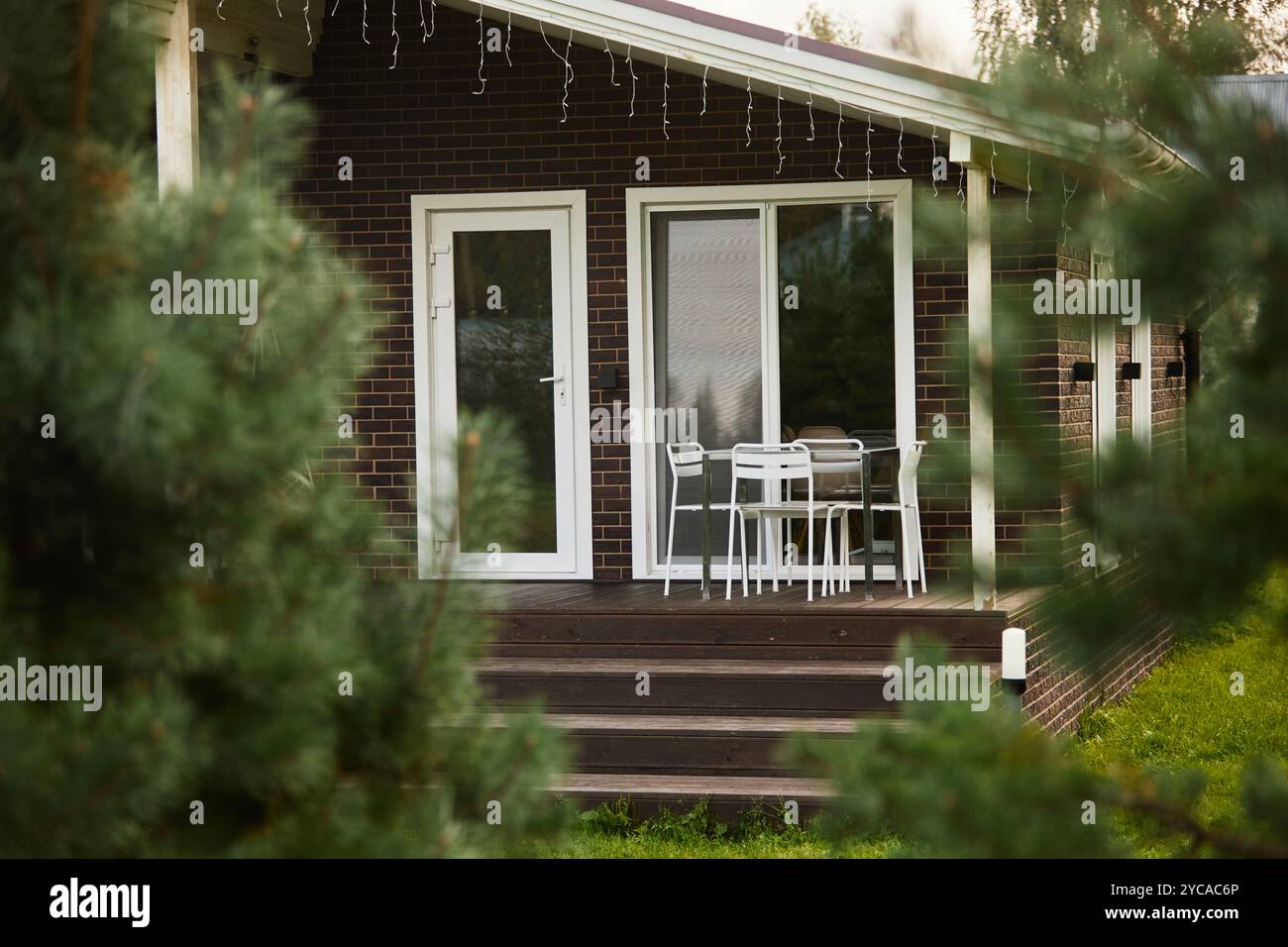 Background image of cute suburban house with patio shot through ...