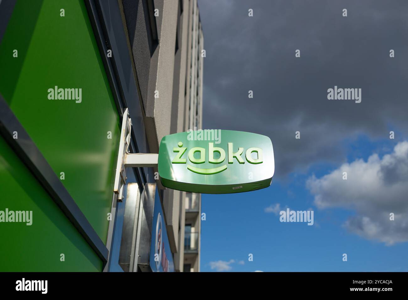 Krakow, Poland - October, 2024: Close up of Zabka logo sign on the building. Zabka is a chain of ...