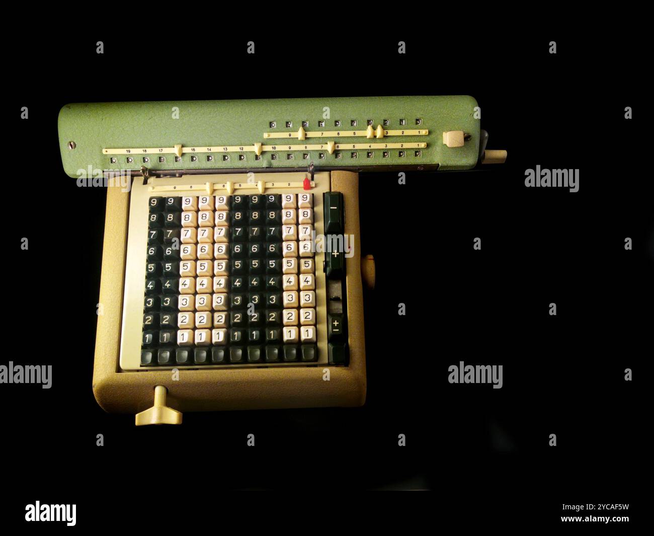 very old calculator isolated on the black background Stock Photo - Alamy