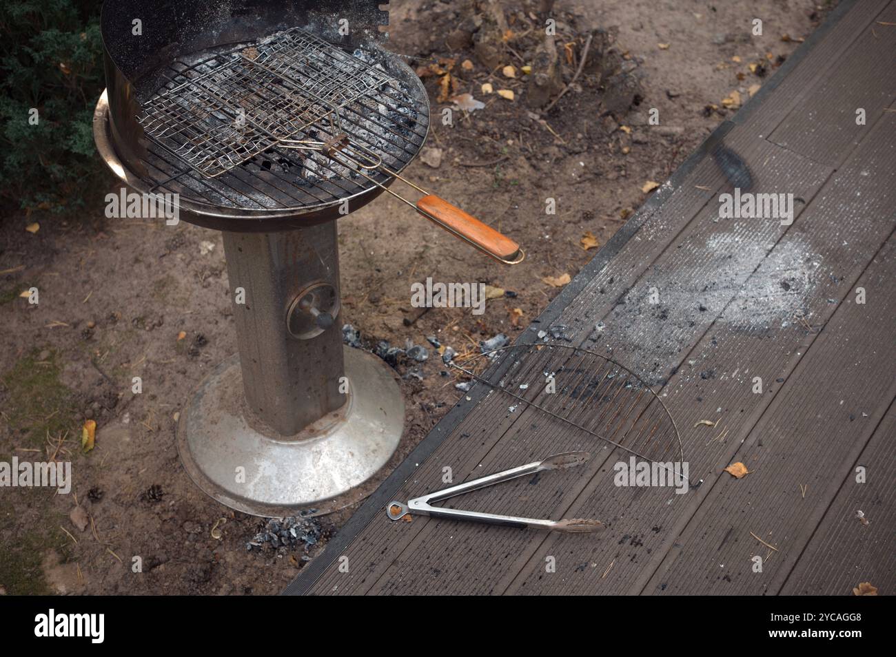 bbq stand and grill abandoned in mess, outdoor shot Stock Photo - Alamy