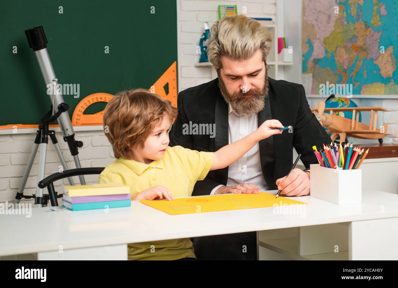 Educational process. Elementary school tutorship. School kids. School ...