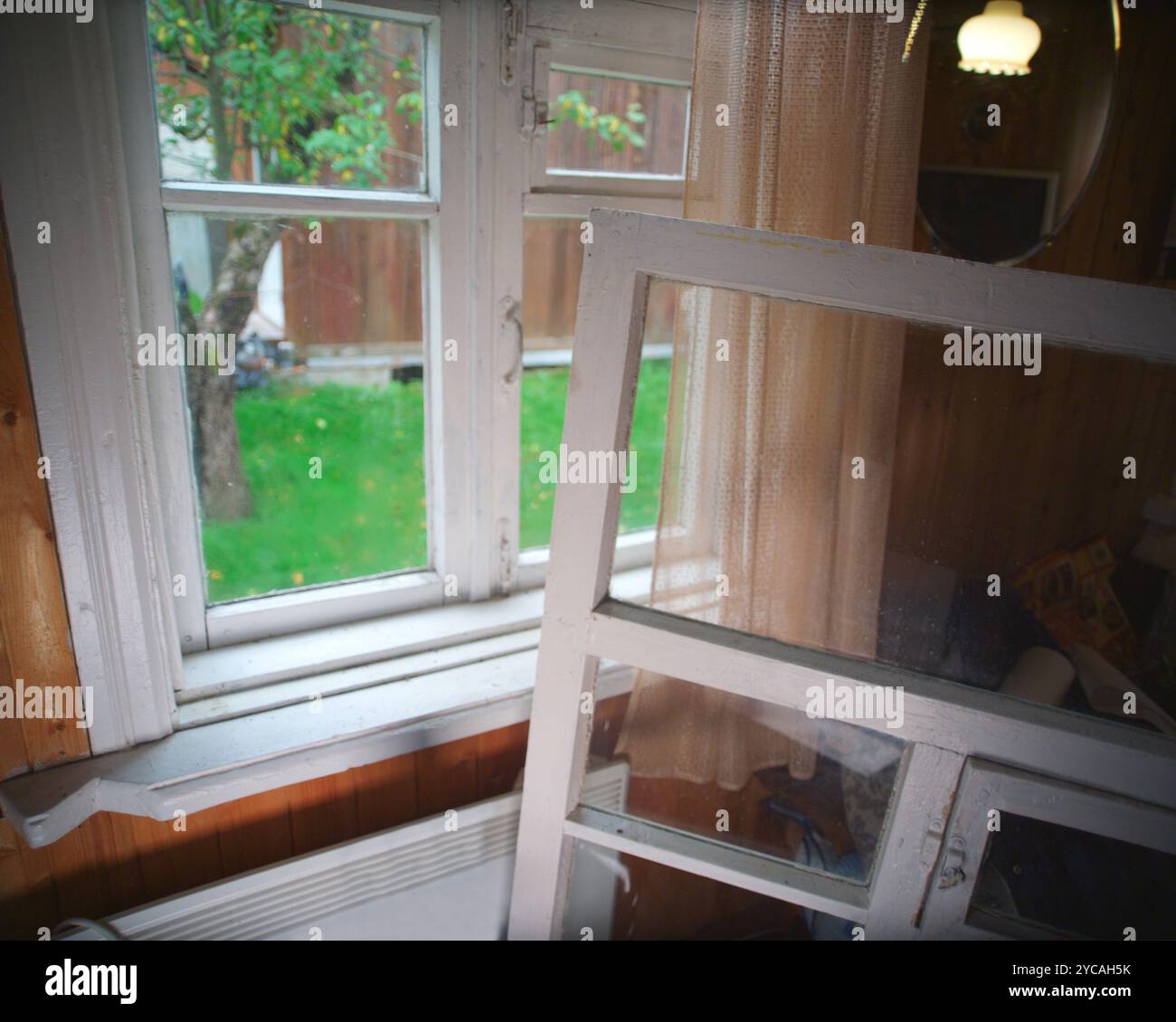 extra window frame installation to keep house warm, indoor shot Stock ...