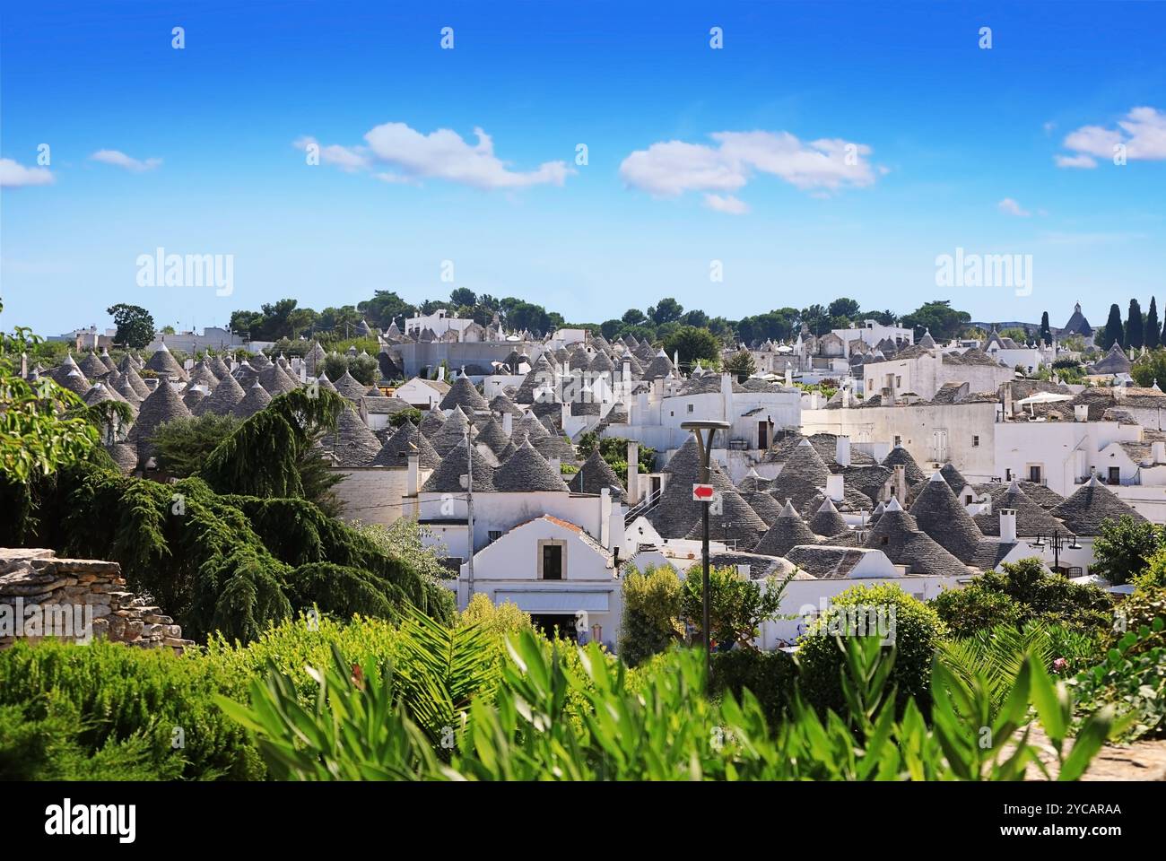 View of the old part of Alberobello with white Trulli houses ...