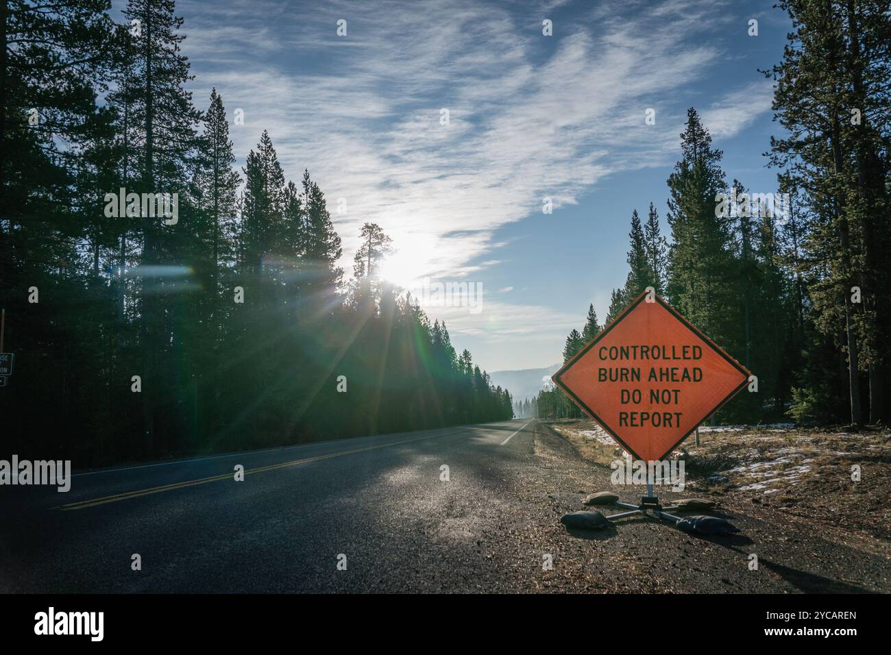 Controlled burn sign along road warning motorists of a prescribed burn ...