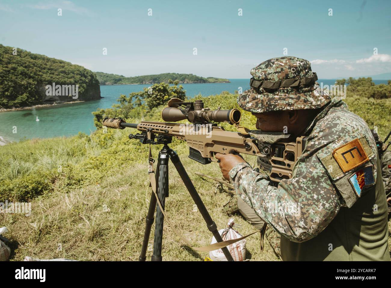 A Philippine Marine fires a Mk22 Mod 0 Advanced Sniper Rifle at water ...