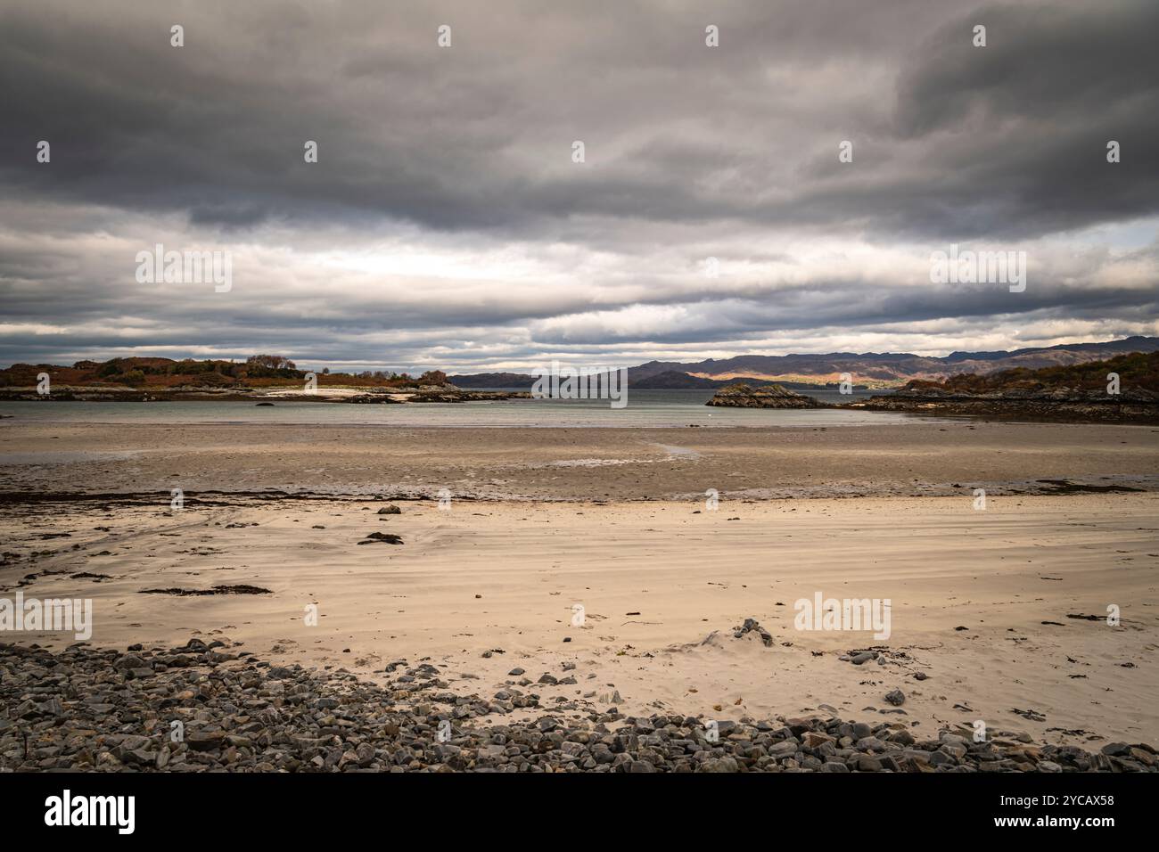 A cloudy, autumnal HDR image of an empty Samalaman Bay with Samalaman Island in the background ...