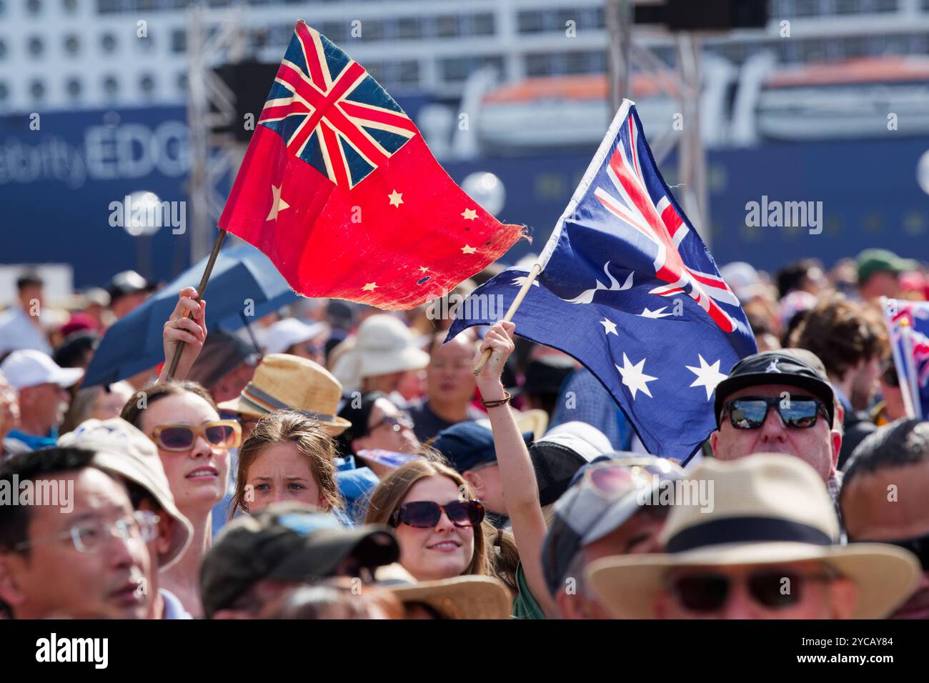Spectators wave the Australian Flags before Queen Camilla and King ...