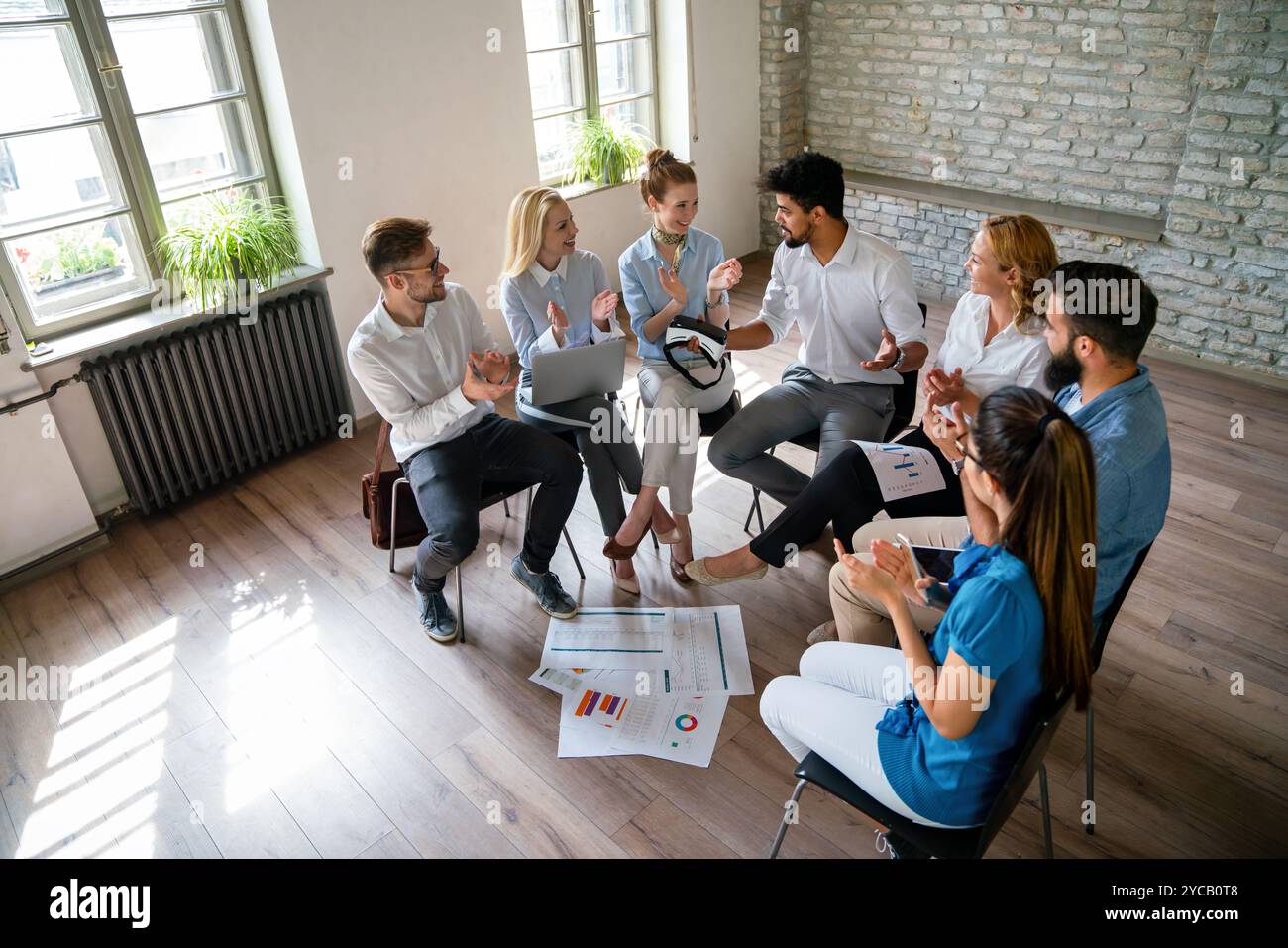 Entrepreneurs and business people achieving goals, celebrating on team ...