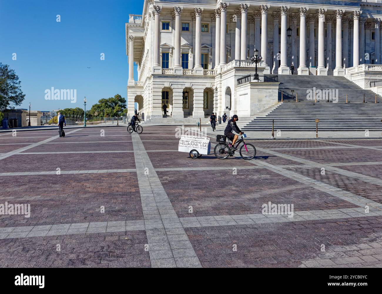 Capitol Police follow a zealous anti-Trump cyclist pulling a “Trump ...