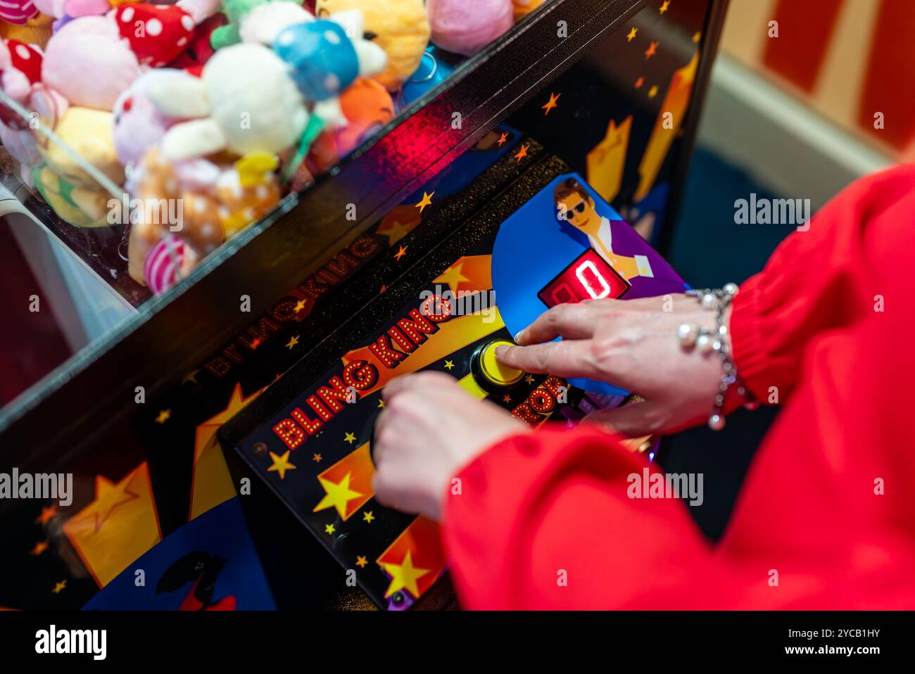 Side, Turkey - 06.06.2024: Woman playing claw crane in theme park ...
