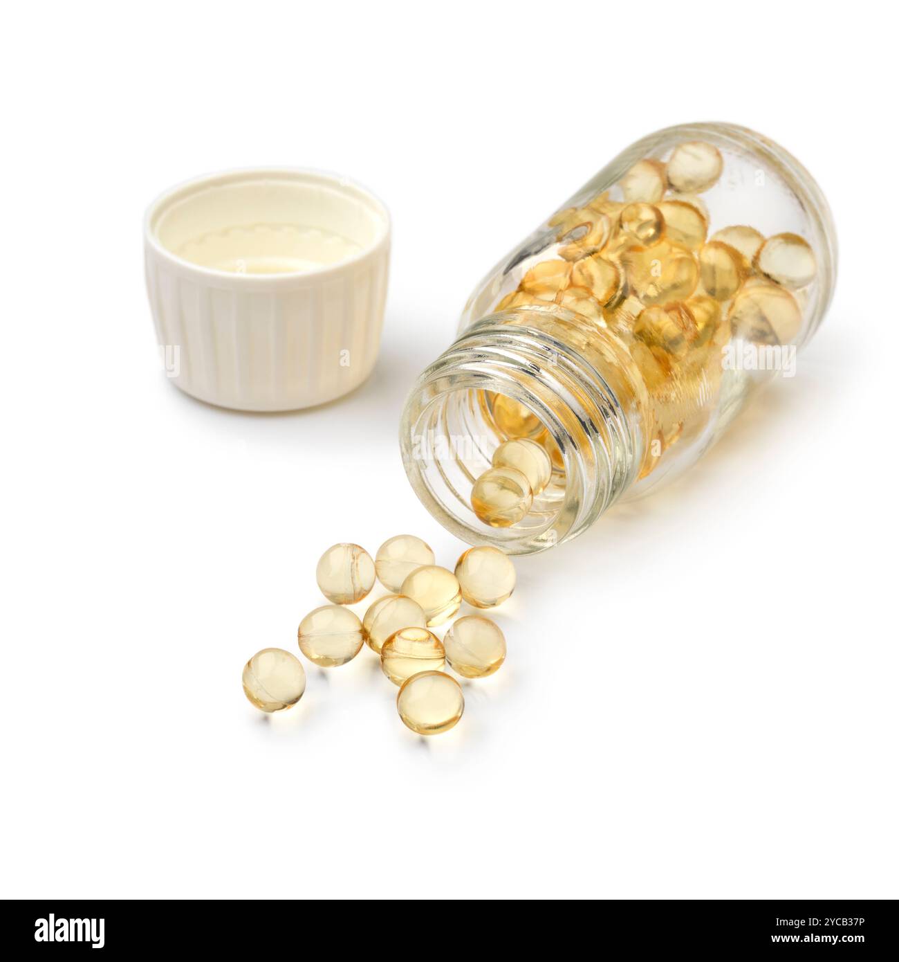 Glass bottle with Vitamin D capsules close up isolated on white ...