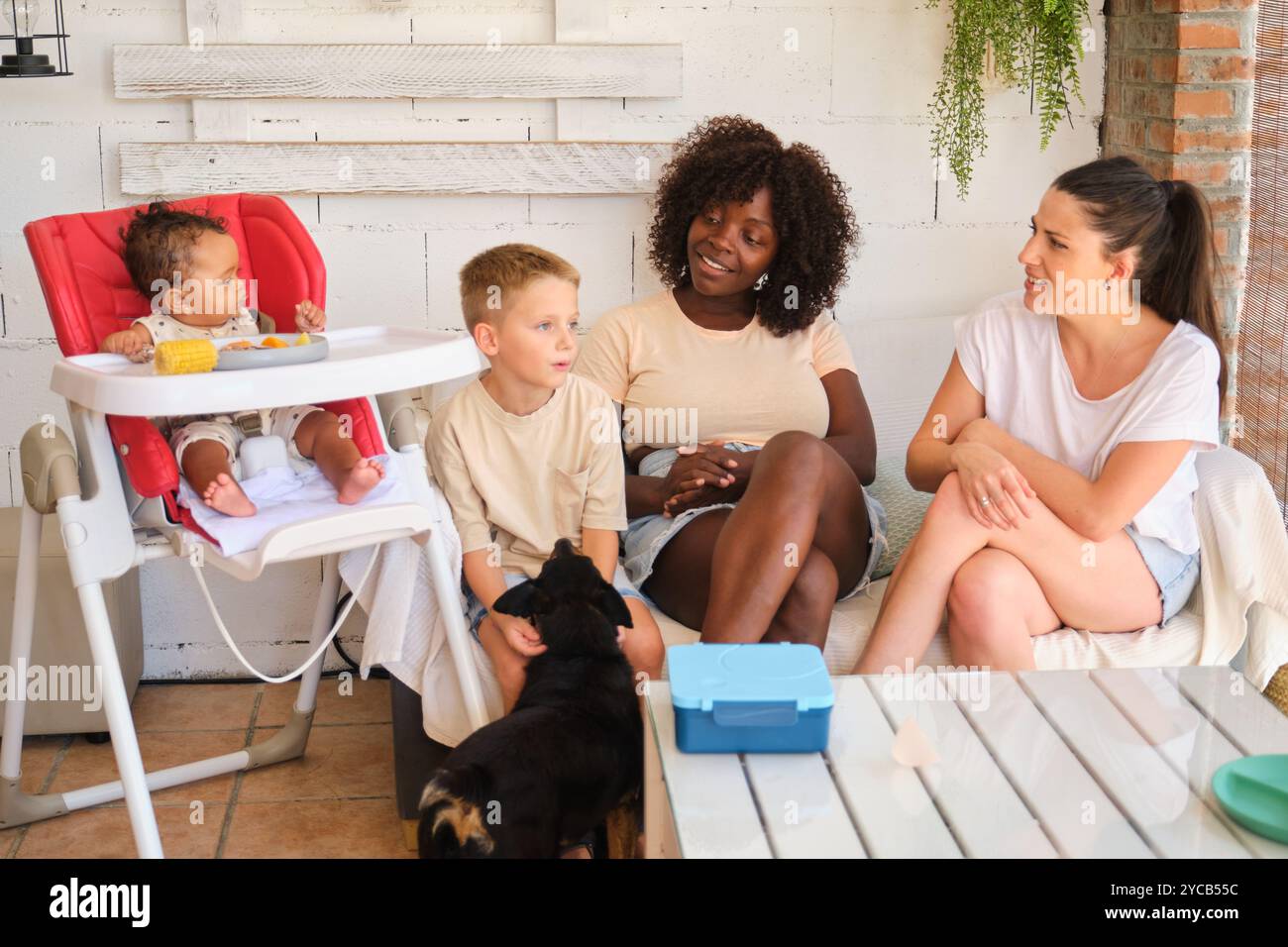A diverse multiracial family together at home. An African American ...