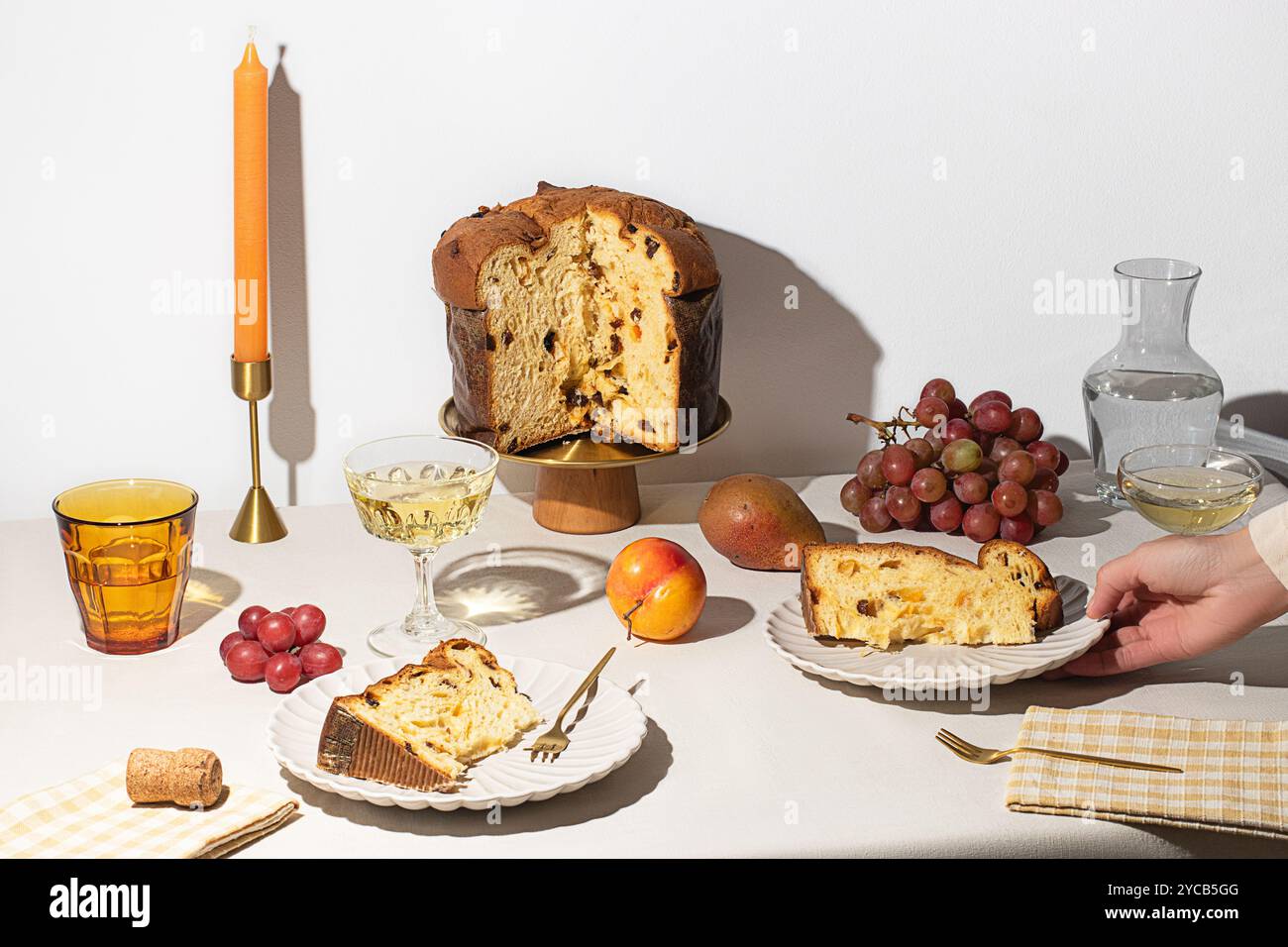 An artful presentation of a traditional Italian Panettone, cut open to ...