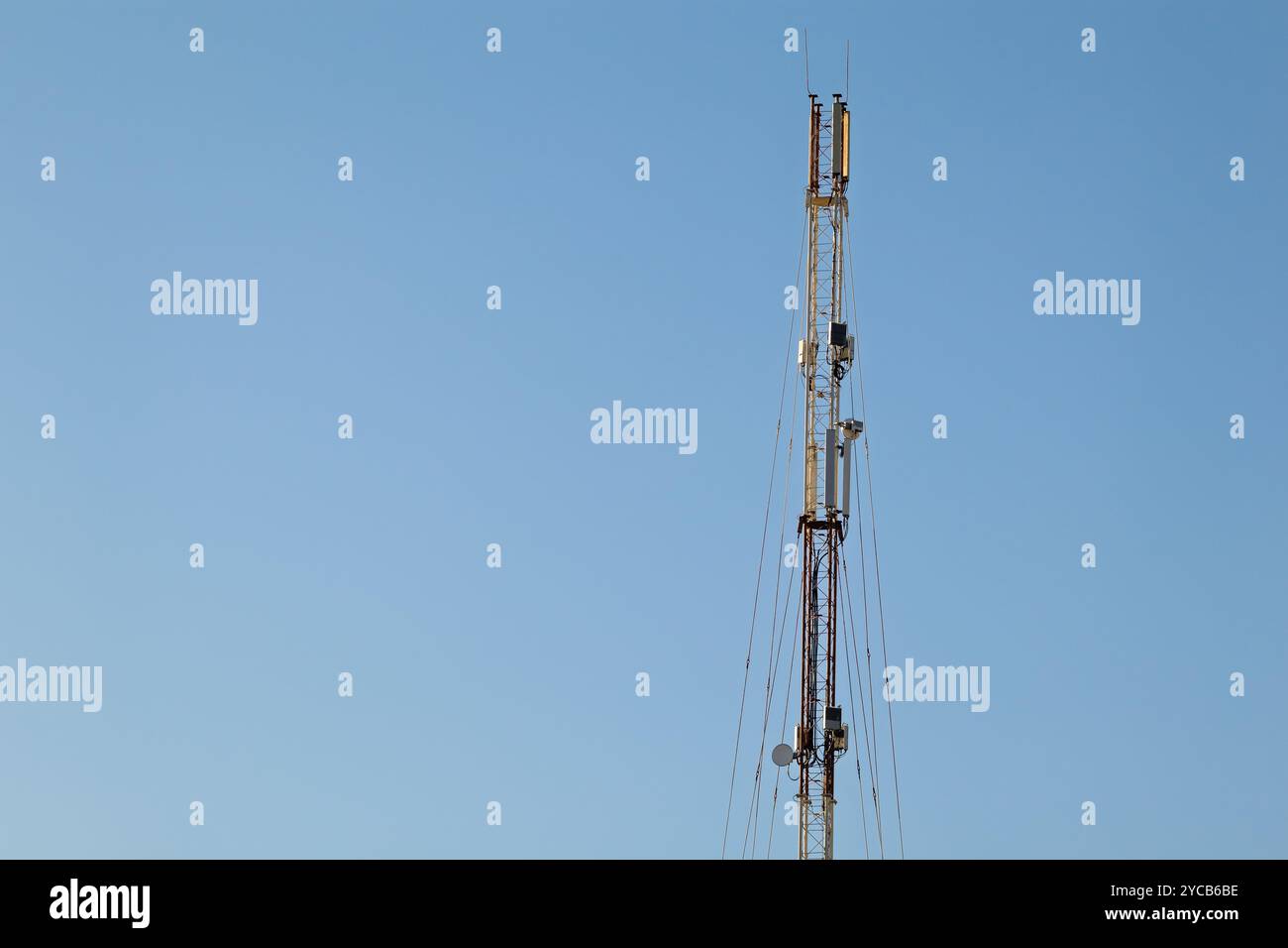 Cellular tower. Telecommunication cell tower against clear blue sky ...