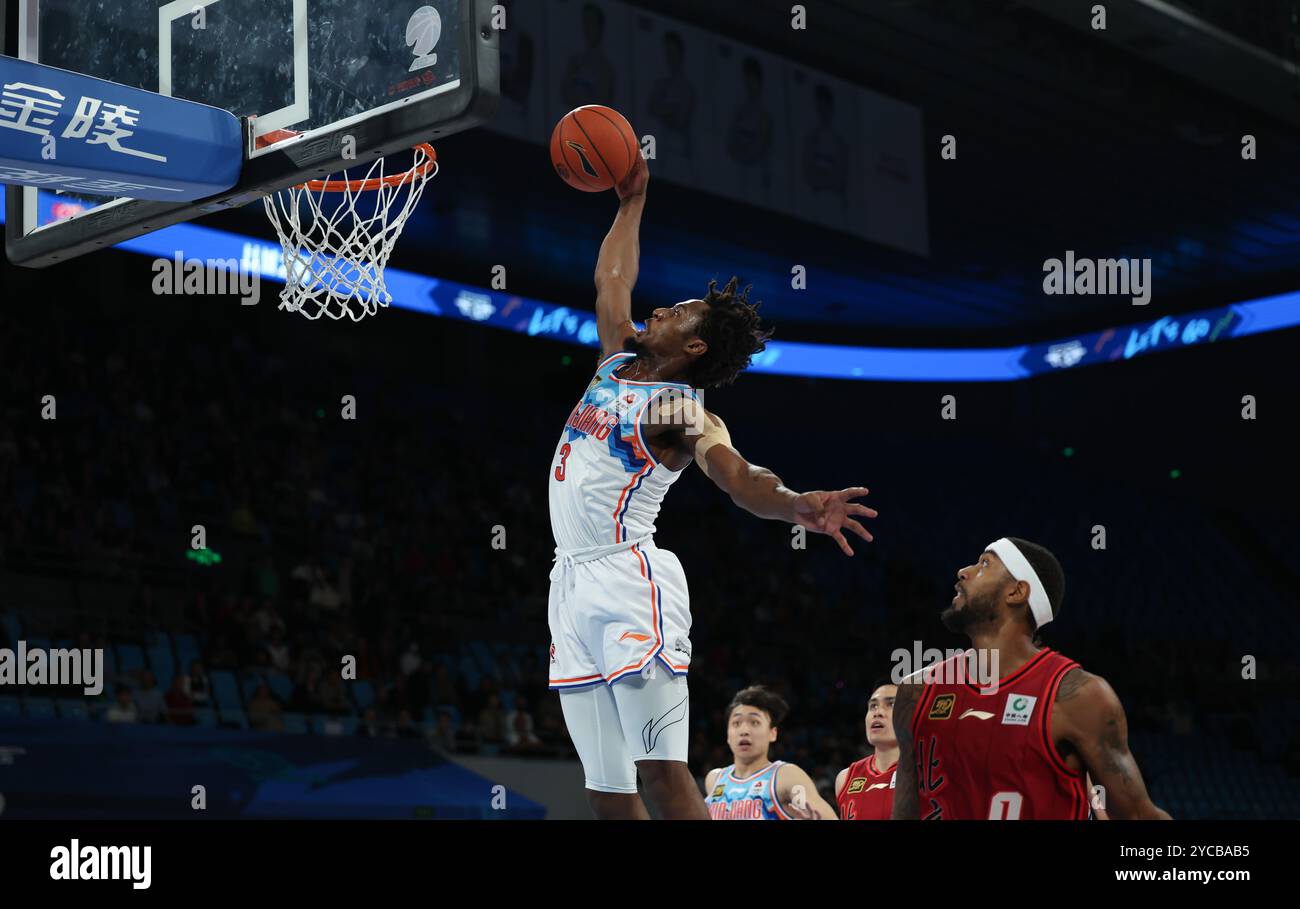 Beijing, China. 22nd Oct, 2024. Ashton Hagans (L) of Xinjiang Flying ...