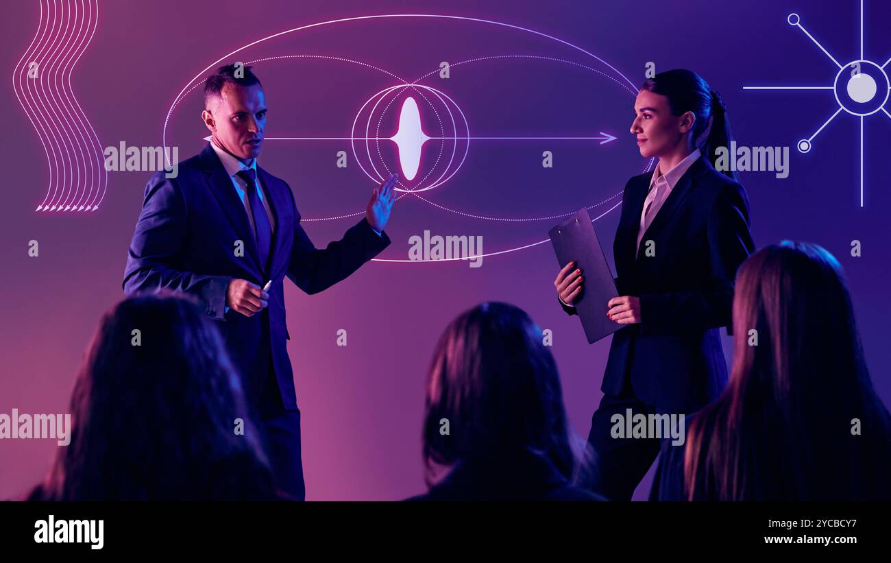 Professional speakers, man and woman, uses advanced visuals to ...