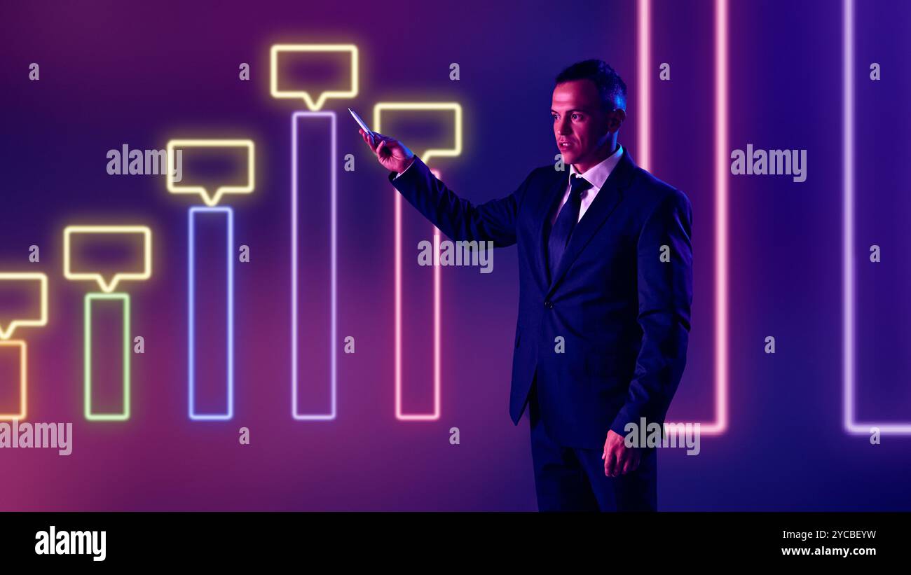 Young businessman, corporate presenter elaborates on data trends, using ...