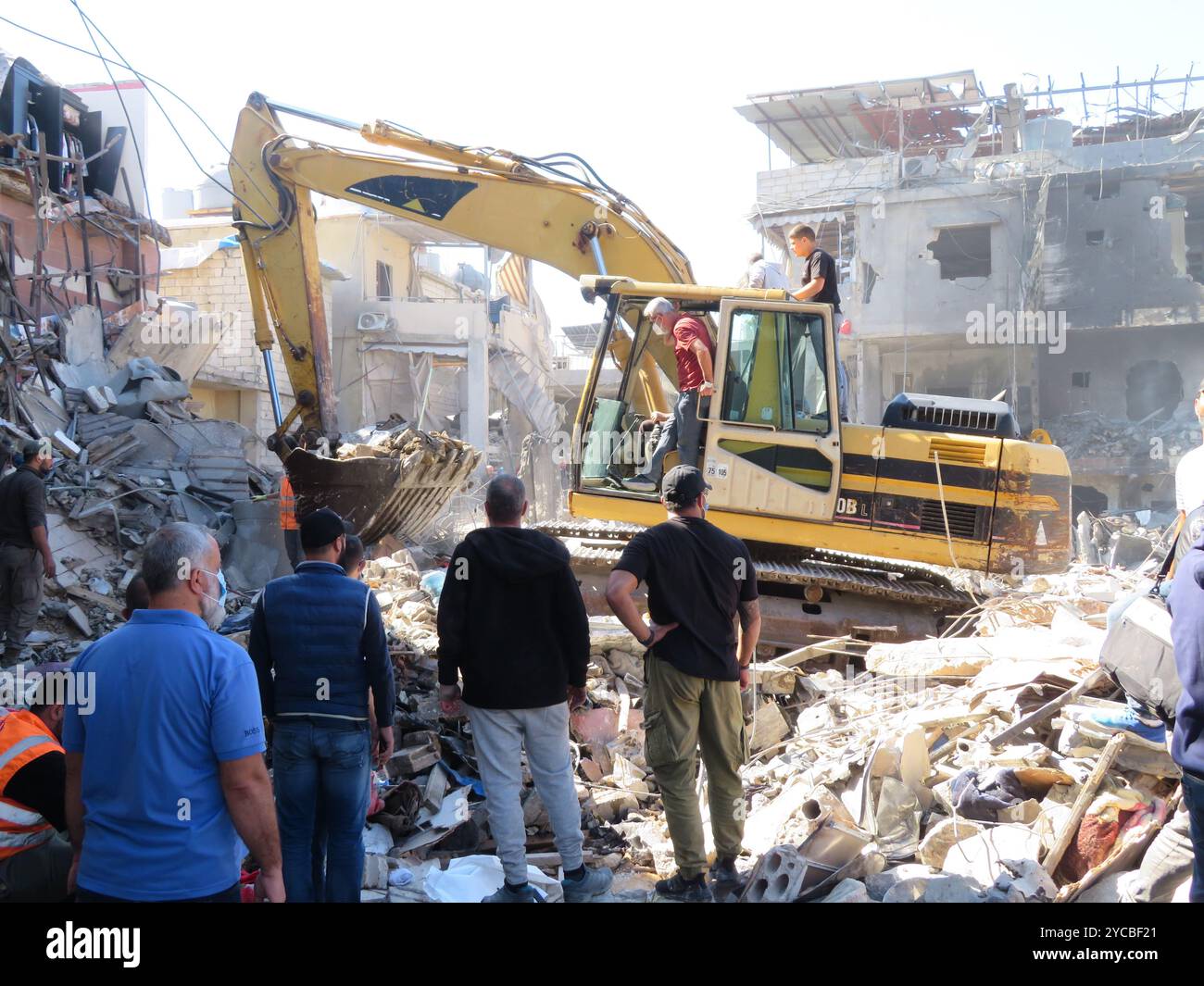 Rescuers search for survivors after an Israeli strike on Monday night ...