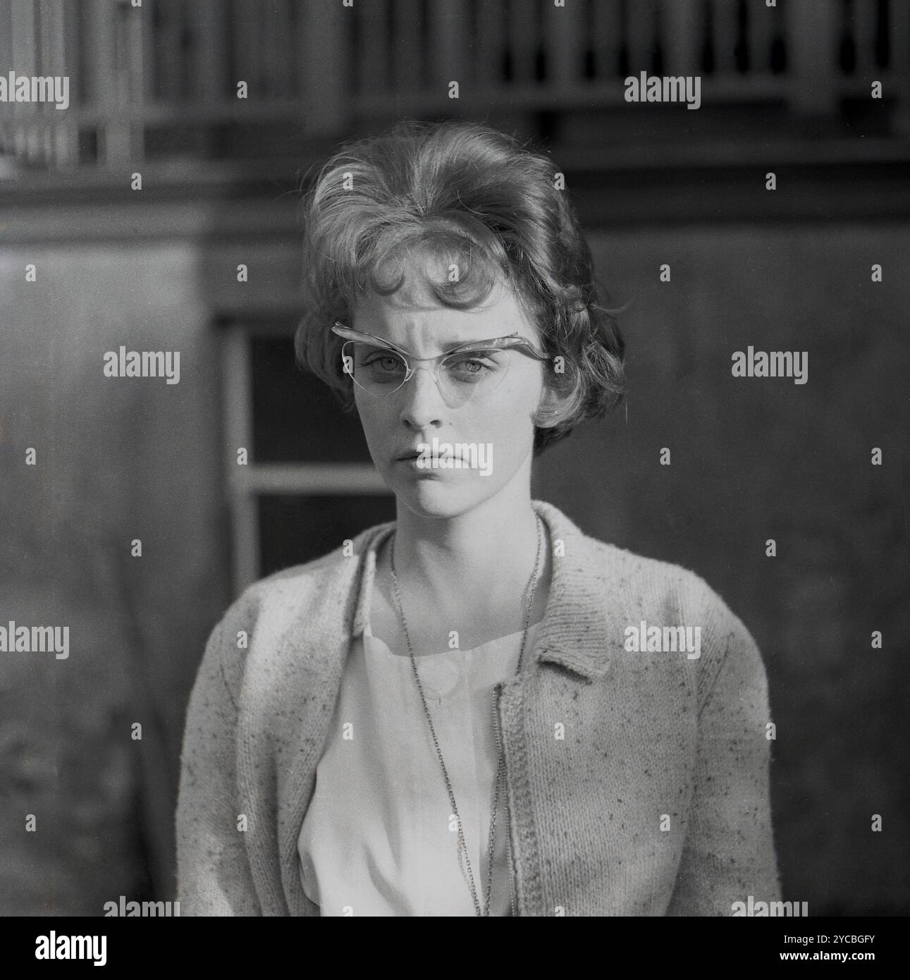 1960s, historical, attractive young lady in a loose top, covered by a ...