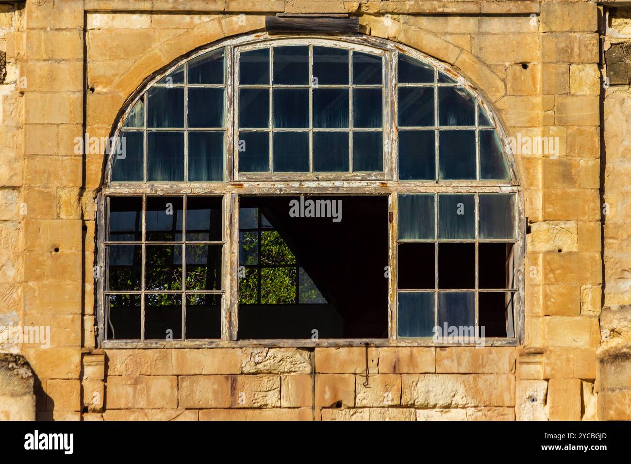 Historic Arched Stone Window of an Abandoned Building Stock Photo - Alamy