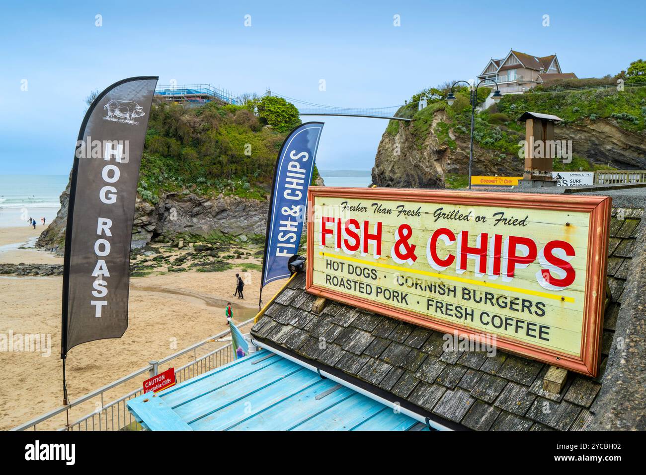 Signs adverts for fast food outlets at Towan beach in Newquay in ...