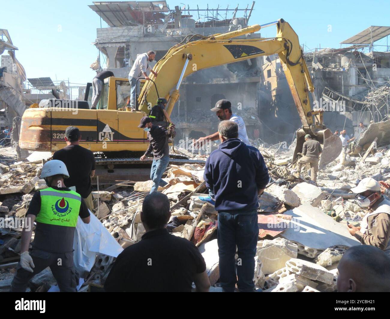 Rescuers at work in Jnah, near Rafic Hariri Hospital, after an Israeli ...