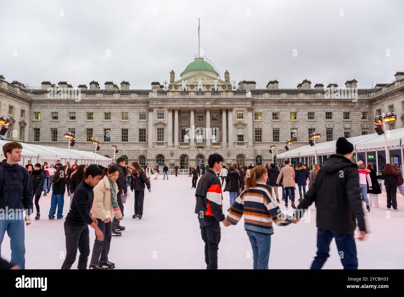 People at the outdoor skating rink in winter at Somerset House, London ...