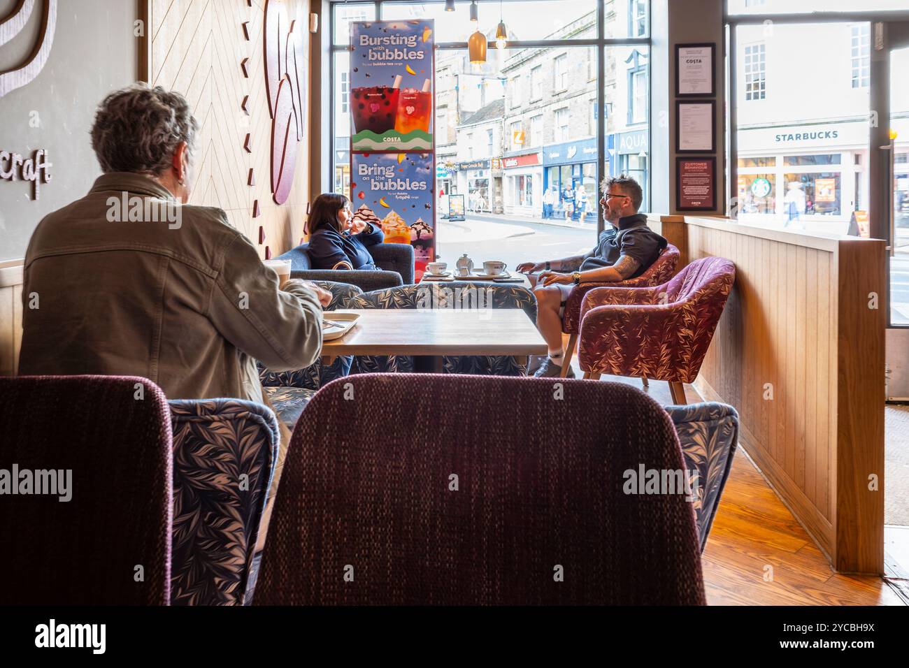 Customers relaxing inside a Costa Coffee shop in Truro City centre in ...